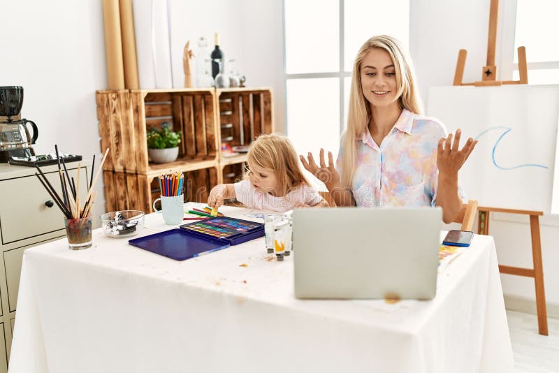 Mother and Daughter Smiling Confident Having Video Call Drawing at Art ...