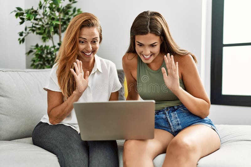 Mother and Daughter Smiling Confident Having Video Call at Home Stock ...