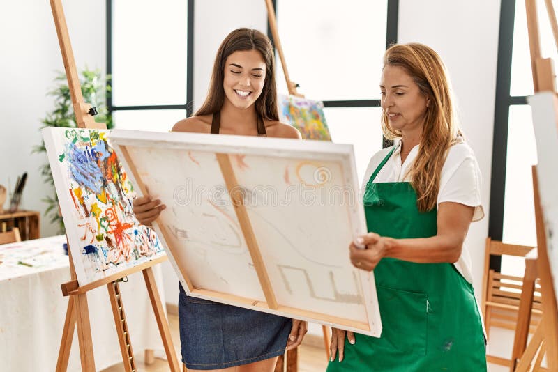 Mother and Daughter Smiling Confident Looking Draw Canvas at Art Studio ...