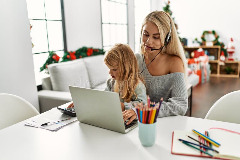 Mother and Daughter Teleworking Sitting by Christmas Tree at Home Stock Photo - Image of enjoy ...