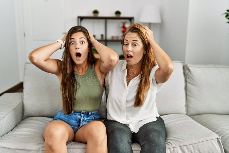 Mother And Daughter Together Sitting On The Sofa At Home Crazy And