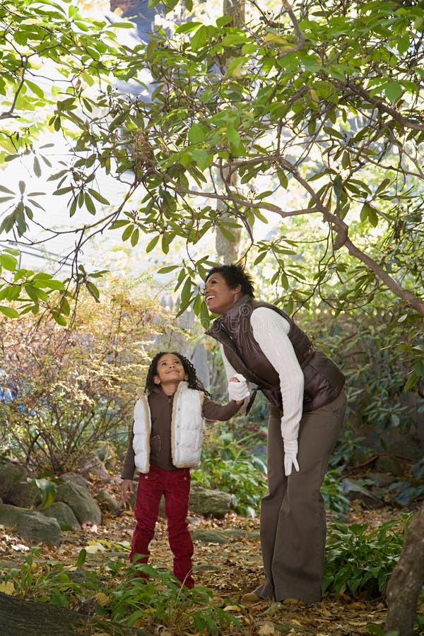 Mother and Daughter Under Tree Stock Image - Image of innocent ...