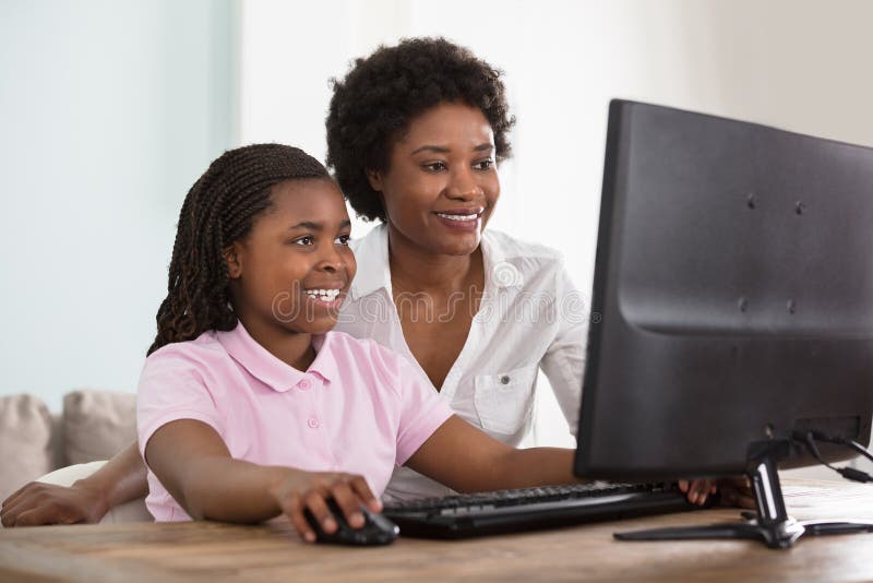 Mother and Daughter Using Computer Stock Photo - Image of dreadlocks ...