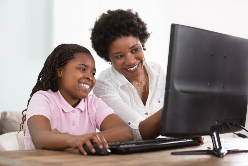 Mother and Daughter Using Computer Stock Photo - Image of indoor, learn ...