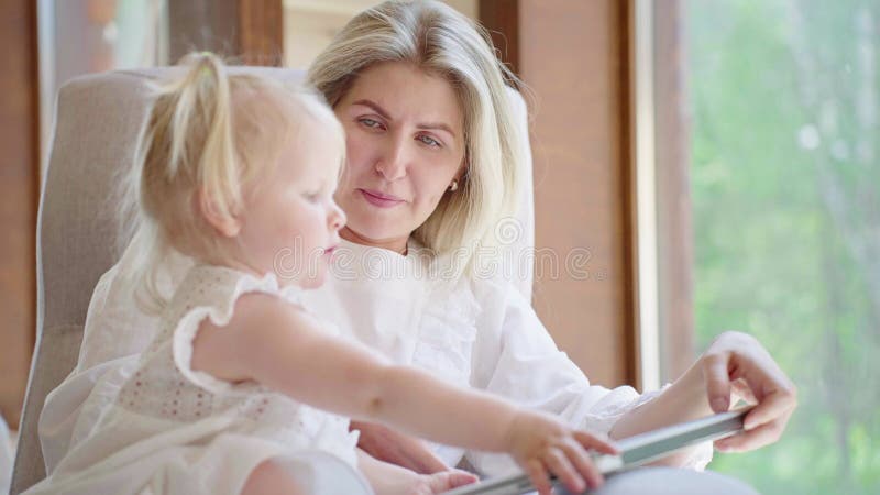 Mother and Daughter Using Laptop at Home Stock Footage - Video of ...