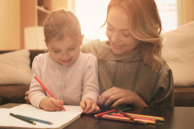 Mother and Daughter Writing. Stock Image - Image of desk, home: 98617327