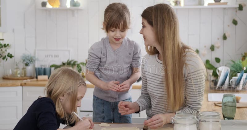 Mother and Daughters Dancing and Making Biscuits in Kitchen Stock Video ...