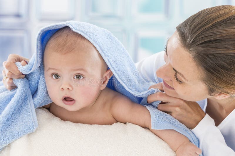 Mother Drying Baby after Bath Stock Photo - Image of laughing, happy ...