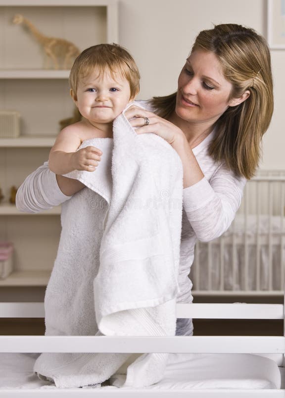Mother Drying off Baby stock image. Image of peaceful - 10320699
