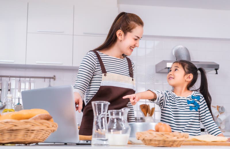 Mother Daughter Learning Bake Book Online Tutorial Computer Laptop Home Stock Photos - Free ...