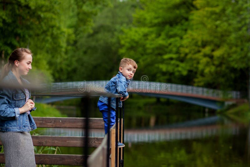 Mother is Experiencing that the Child Will Fall into the Water. a ...