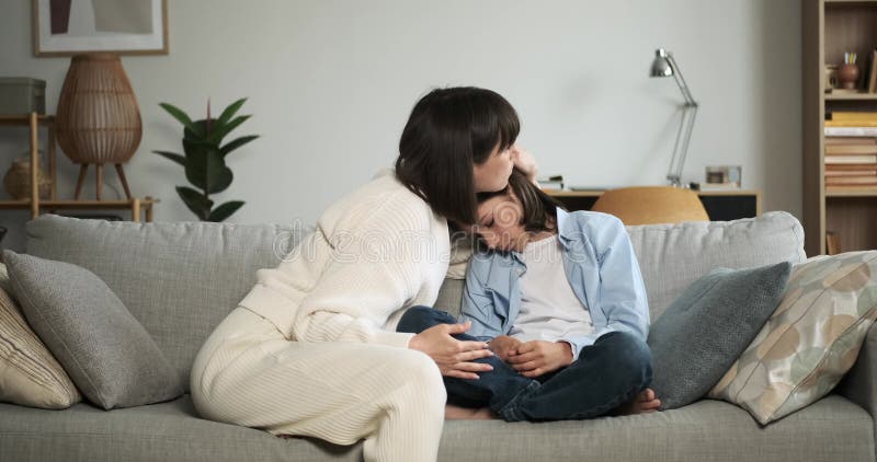 Mother Expressing Compassion and Embracing Upset Son Stock Video - Video of negative, couch ...