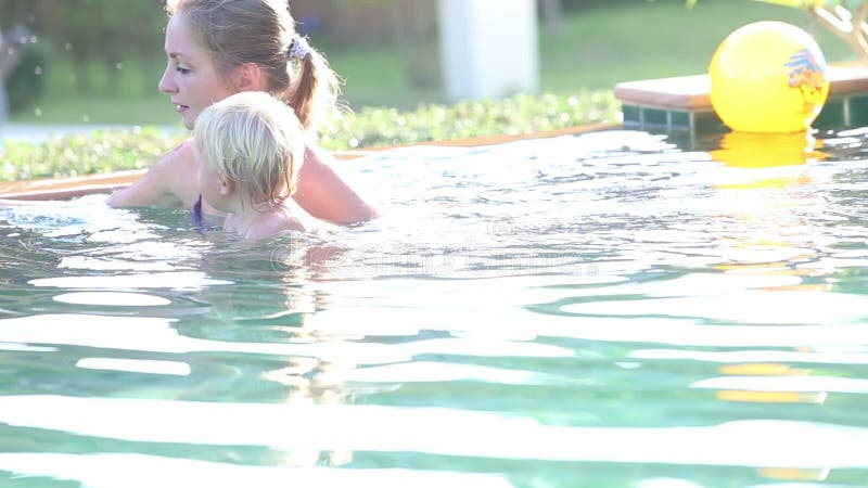 Mom And Daughter Play In The Pool Stock Footage Video Of Female Ball