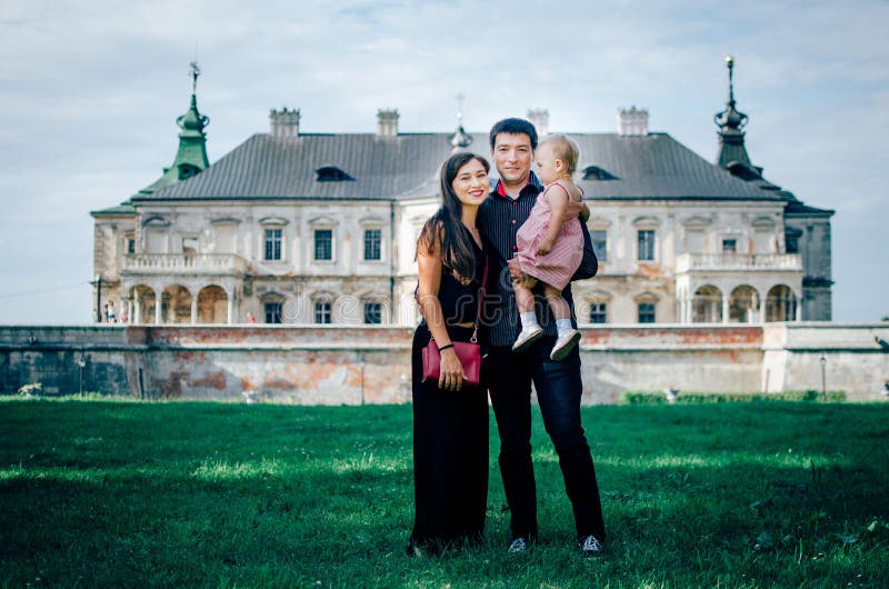 Mother, Father and Their Little Daughter Stock Photo - Image of elegant ...