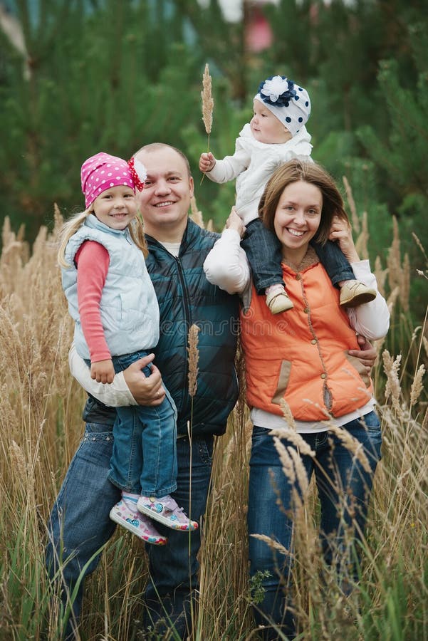 Happy Father Holding Two Little Daughers Stock Photo - Image of ...