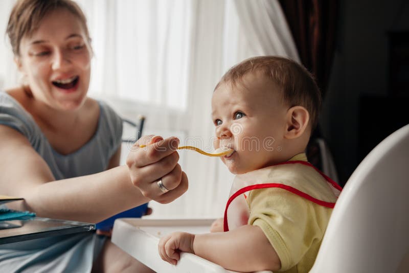 Mother Feeding Baby Boy stock image. Image of healthy - 53820561