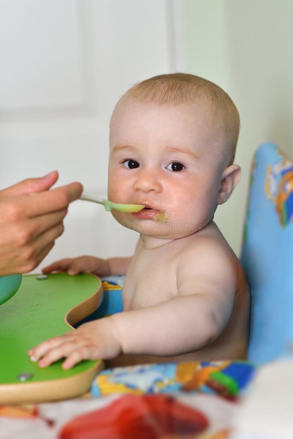 Mother Feeding Baby Boy at Home Kitchen Stock Image - Image of mother ...