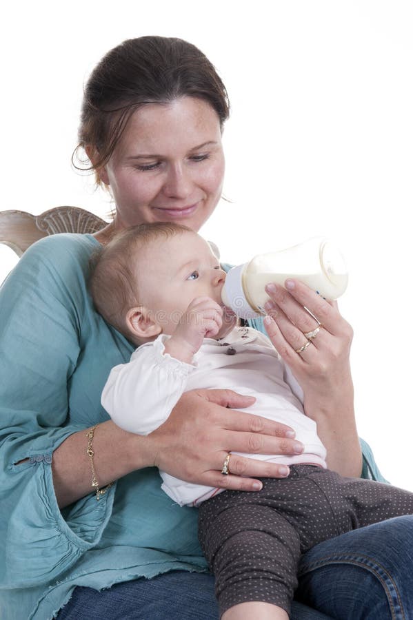 Mother feeding her baby stock photo. Image of milk, studio - 27036988