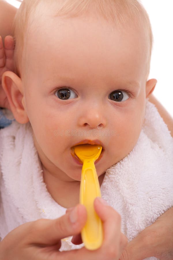 Mother Feeding Her Baby Son Using Spoon Stock Image - Image of baby ...