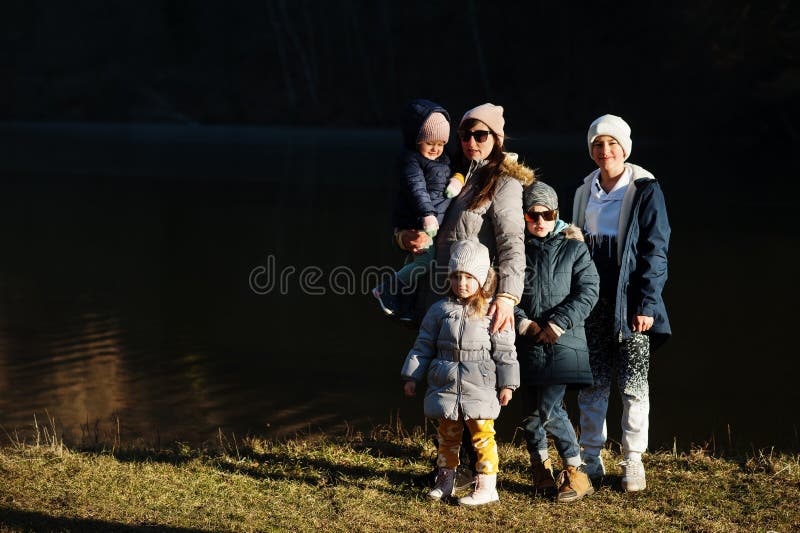 Mother with Four Kids in Pound at Early Spring Park Stock Image - Image ...