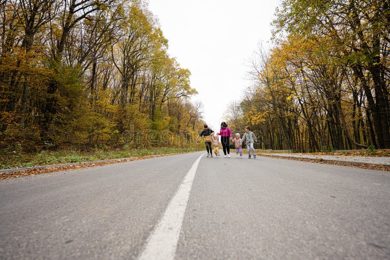Mother with Four Kids Running on Road at Autumn Fall Forest Stock Image ...