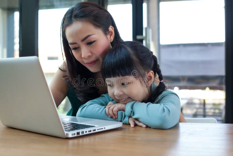 Mother and Girl Play Computer at Home Stock Photo - Image of quarantine ...