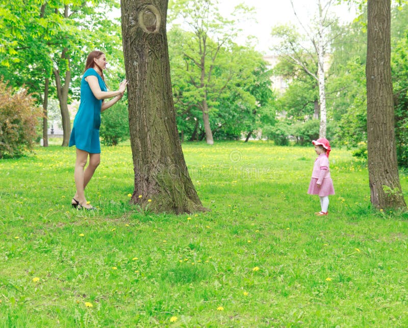 Mother and Girl Playing Hide-and-seek Stock Photo - Image of hiding ...