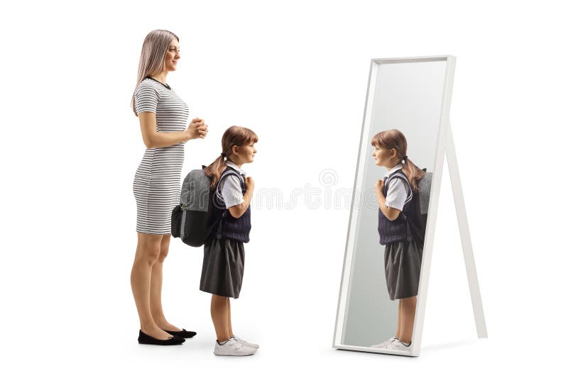 Mother and Girl in a School Uniform Getting Ready in Front of a Mirror ...