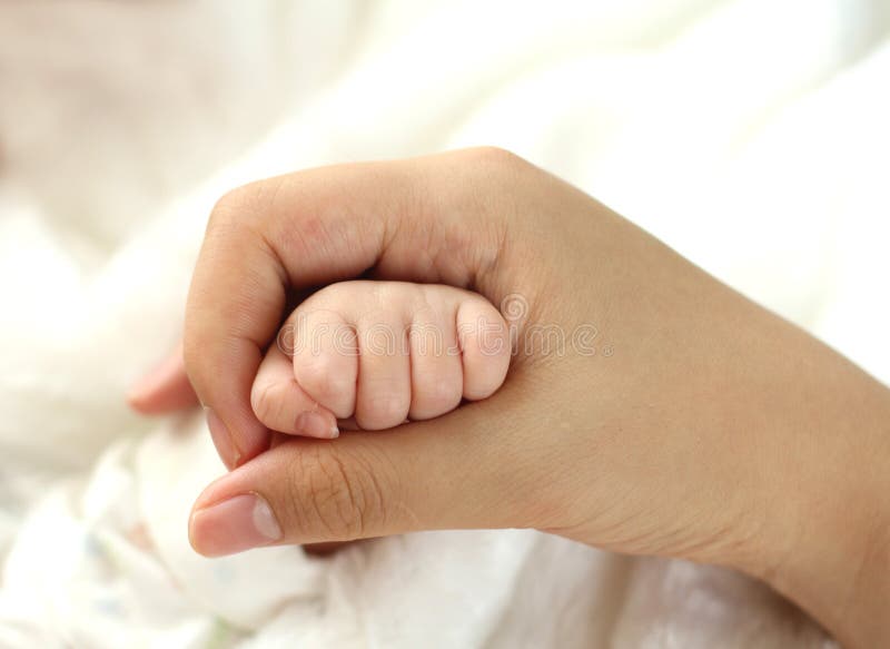 Mother hand hold baby hand stock image. Image of woman - 77577965
