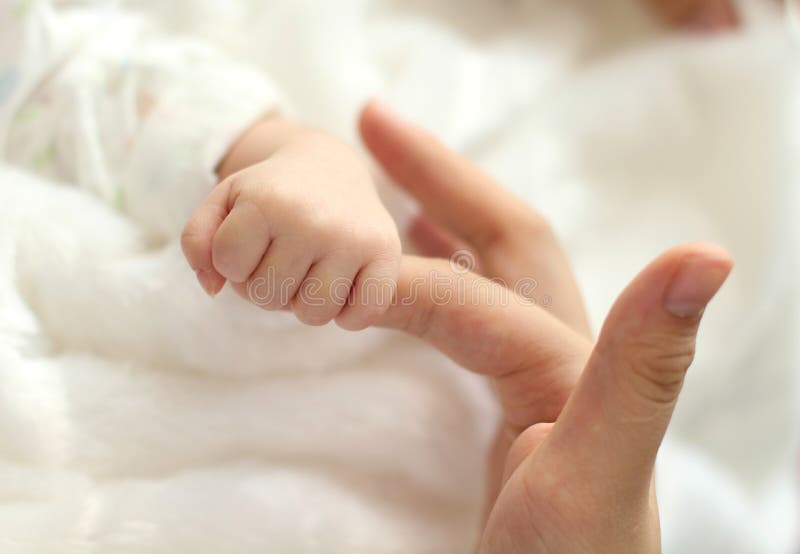 Mother hand hold baby hand stock image. Image of newborn - 77577971