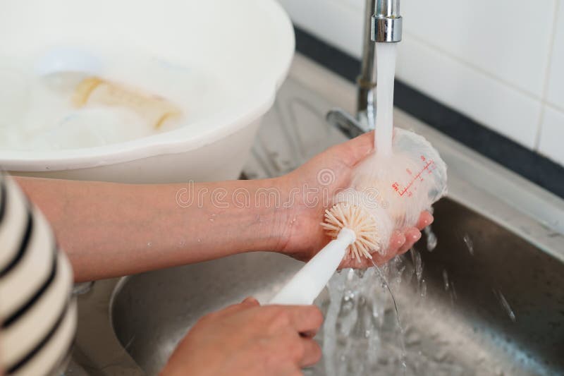 Mother Hand Washing Baby Plastic Milk Bottle Stock Image - Image of ...