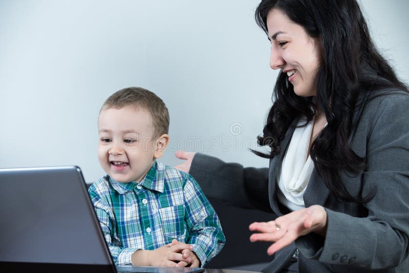 Mother Having a Great Time with Her Boy while Looking at the Computer ...