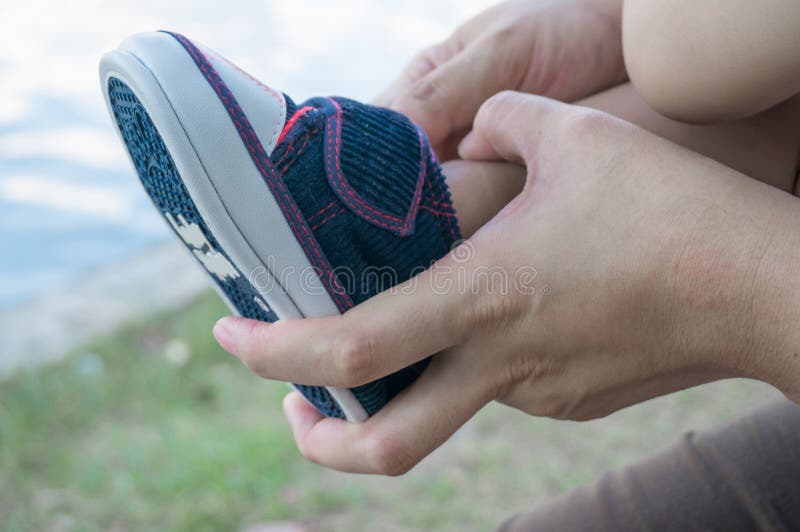 Mother Help Child Put on Shoe Stock Image - Image of care, suburb: 76780543