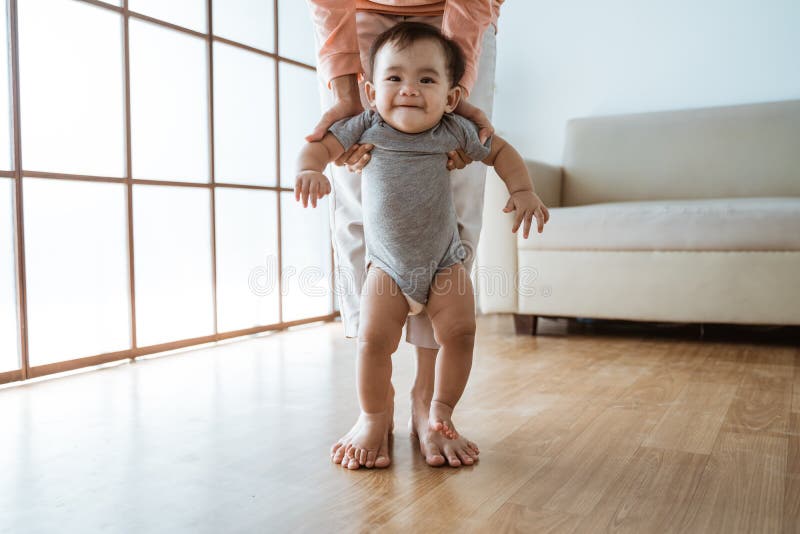 Mother Help Her Baby To Walk Her First Step Stock Image - Image of love ...