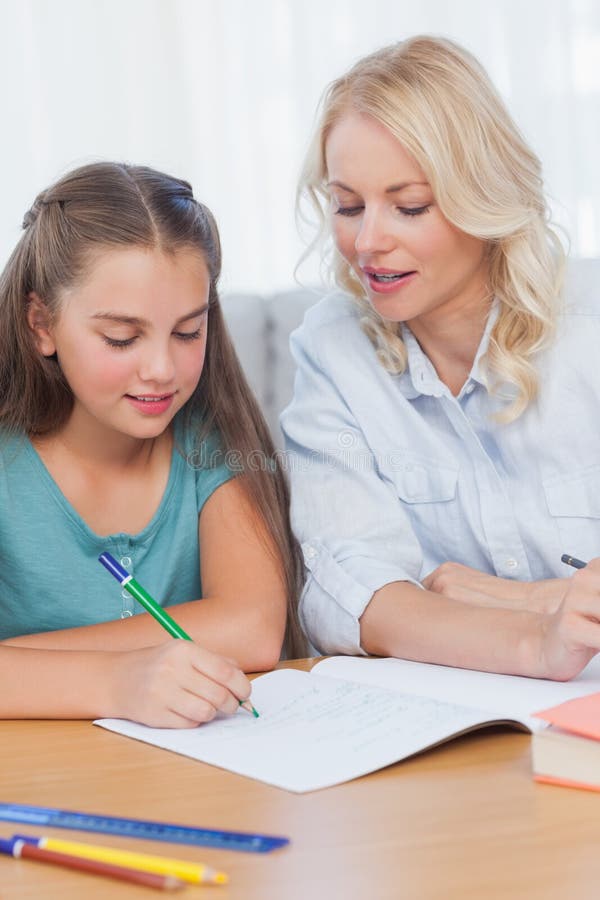 Mother Helping Daughter with Homework Stock Image - Image of learning ...