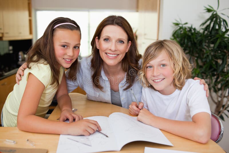 Mother Helping Her Children with Homework Stock Image - Image of school ...
