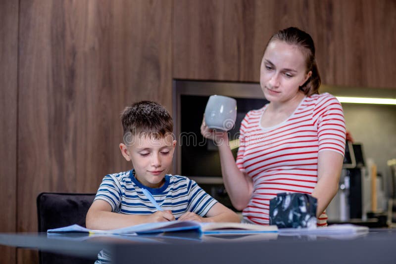 Mother Helping Her Son with Homework at Home. Mom Helping Her Son with Homework. AI Generated ...