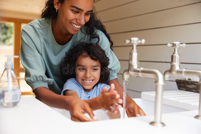 Mother Helping Young Son Wash Hands in Sink Stock Image - Image of ...