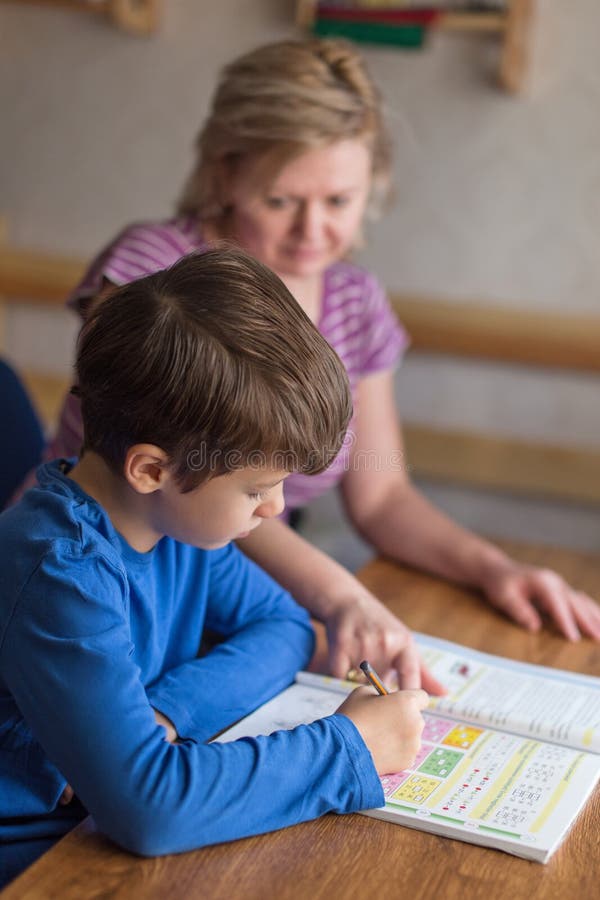 Mother Helps To Son Solving Mathematics Homework Stock Photo - Image of explain, exercise: 106682366