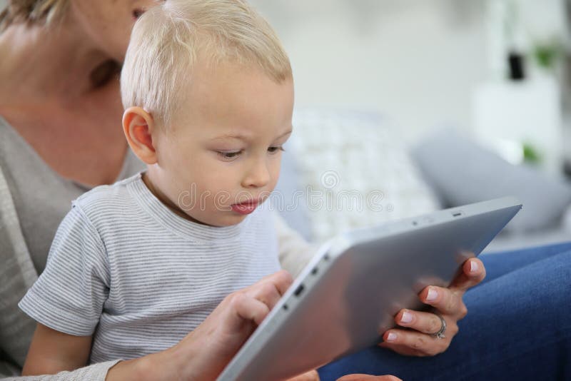 Mother and Her Baby Child Using Tablet Stock Image - Image of playing ...