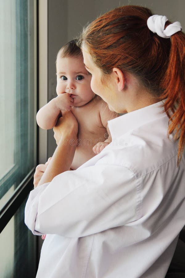 Mother with her baby stock photo. Image of home, family - 47954928