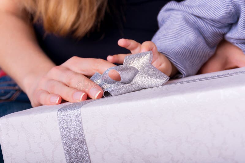 Mother with Her Baby Unpack a Gift Stock Photo - Image of helping ...