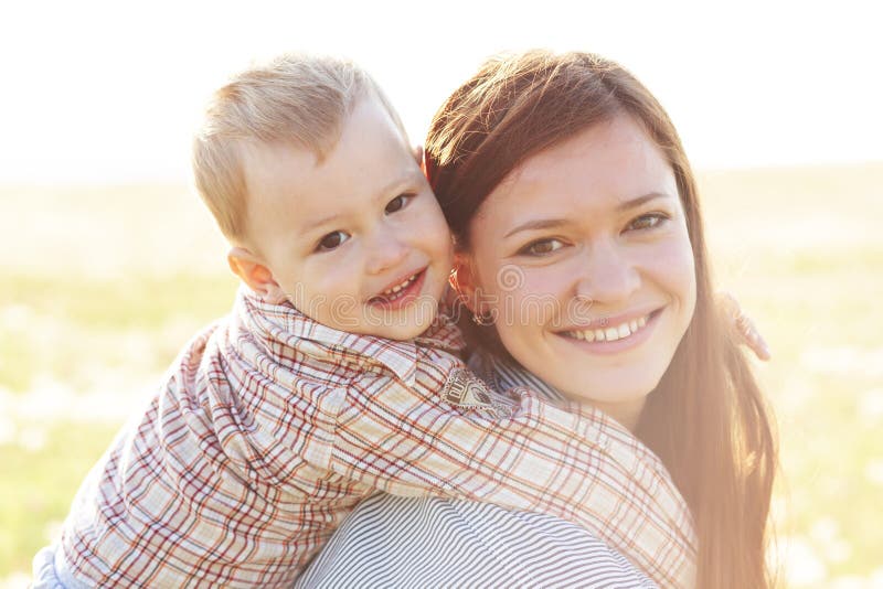 Mother with Her Child in Sunlight Stock Photo - Image of smile, child ...