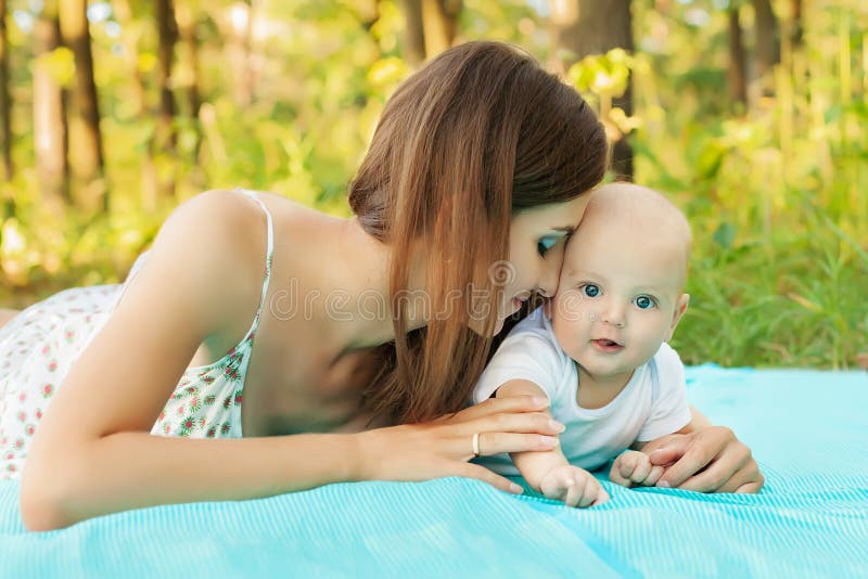 Mother with Her Child Take Rest Stock Photo - Image of outside, grass ...