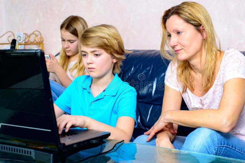 Mother and Her Children Using Computer Stock Photo - Image of ...