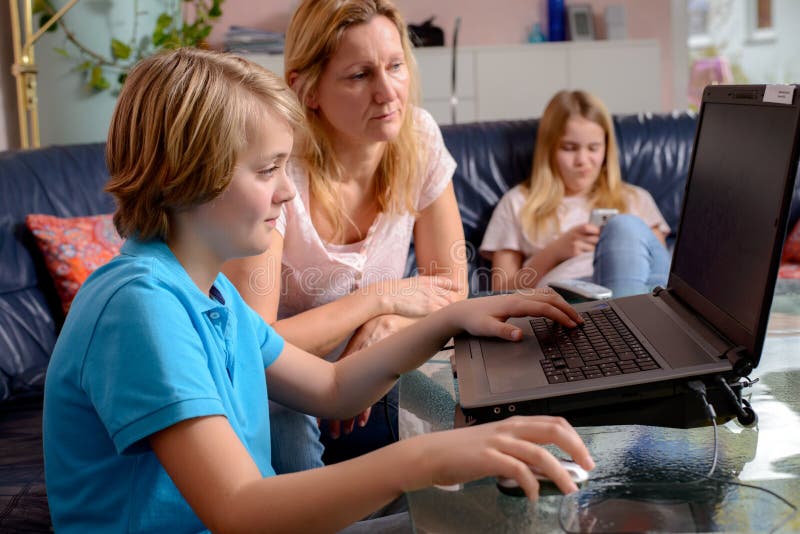 Mother and Her Children Using Computer Stock Image - Image of mother ...