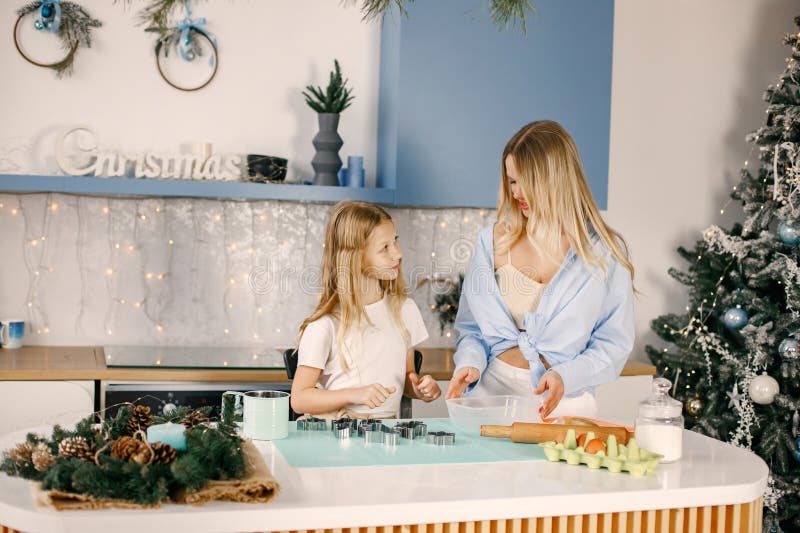 Mother and Her Daughter Cooking Christmas Ginger Biscuits at the ...