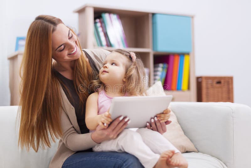 Happy Family Mother and Children Playing in Tablet Pc Stock Photo ...