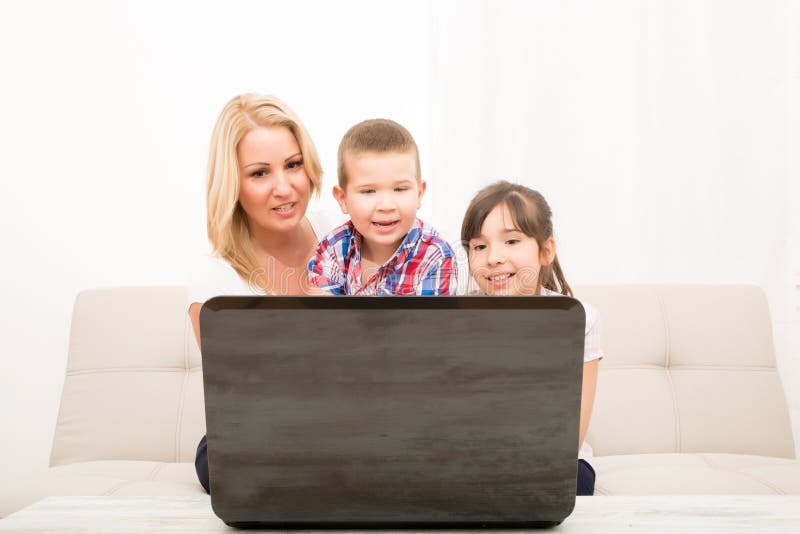 Mother with Her Kids Using a Laptop Computer Stock Photo - Image of ...