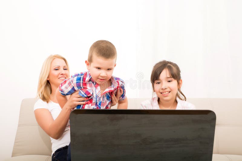 Mother with Her Kids Using a Laptop Computer Stock Photo - Image of ...